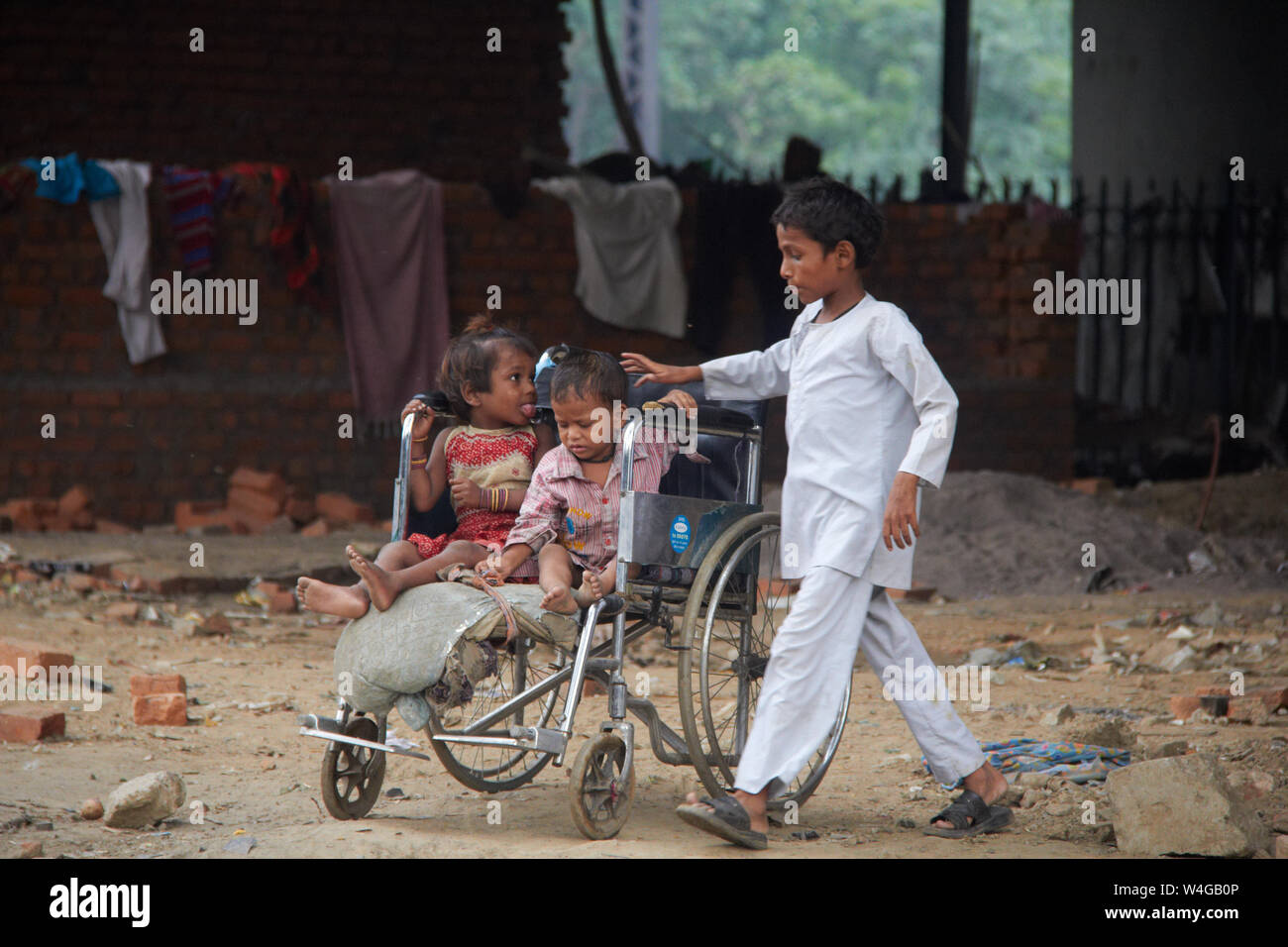 Poor child on a wheelchair Stock Photo - Alamy
