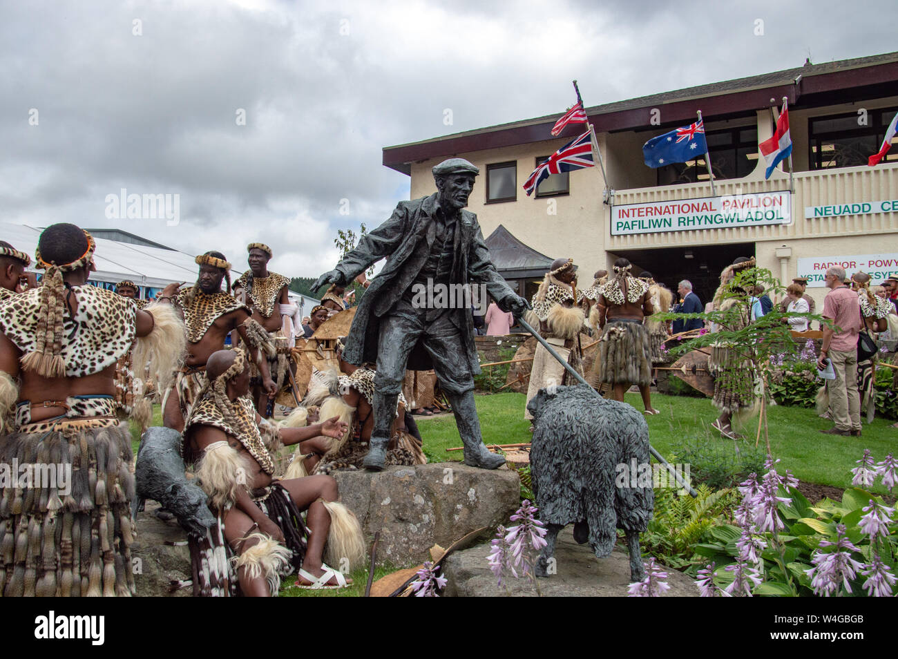 Zulu warriors beside the drover's statue at the Royal Welsh showground ...