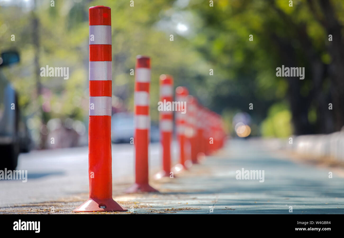 Orange traffic reflective bollards Stock Photo - Alamy