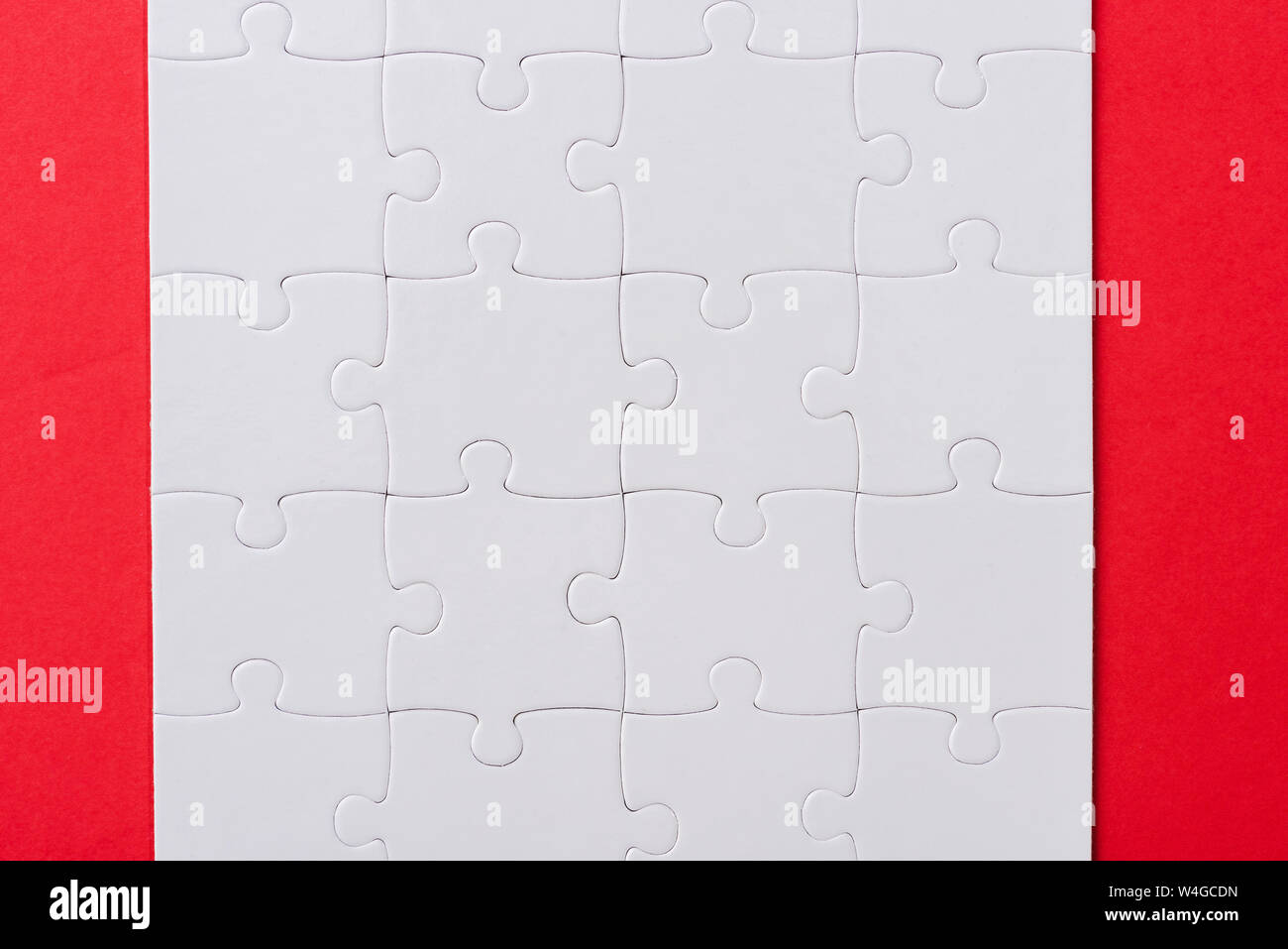 top view of set with white jigsaw puzzle pieces isolated on red Stock ...