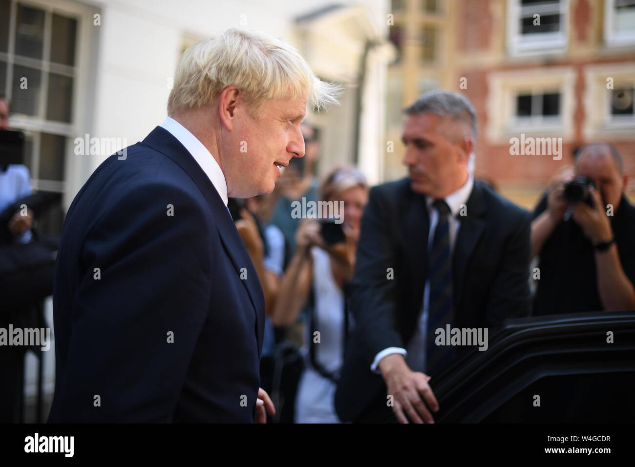 Newly elected leader of the Conservative party Boris Johnson leaves his ...