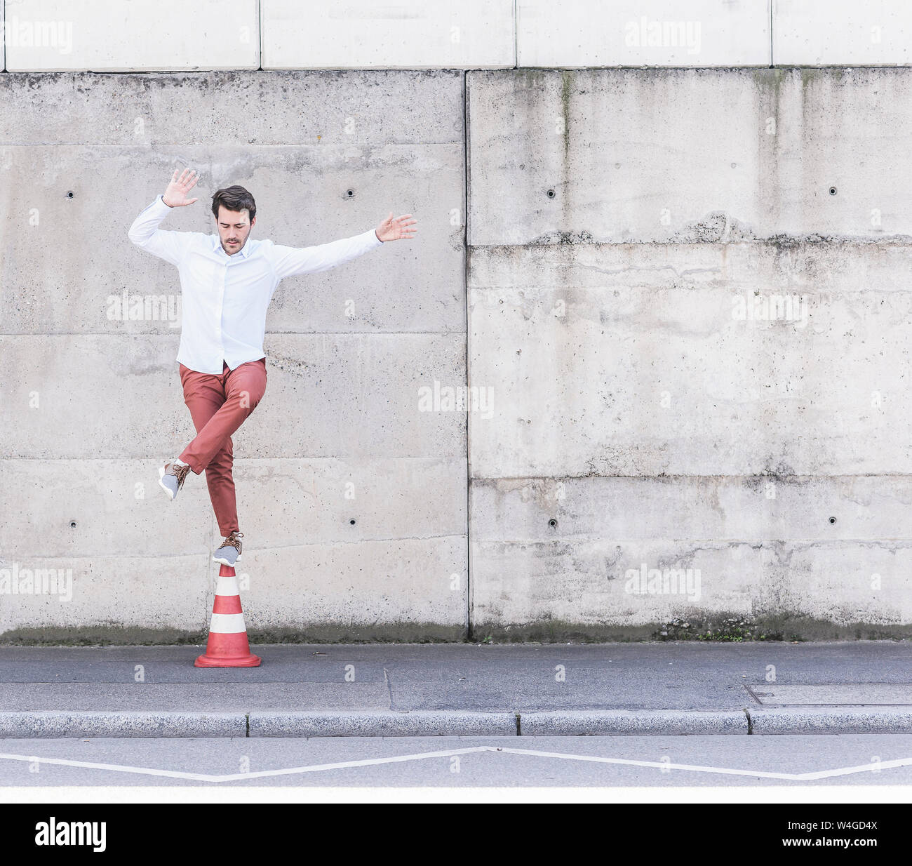 Traffic cone and man hi-res stock photography and images - Alamy
