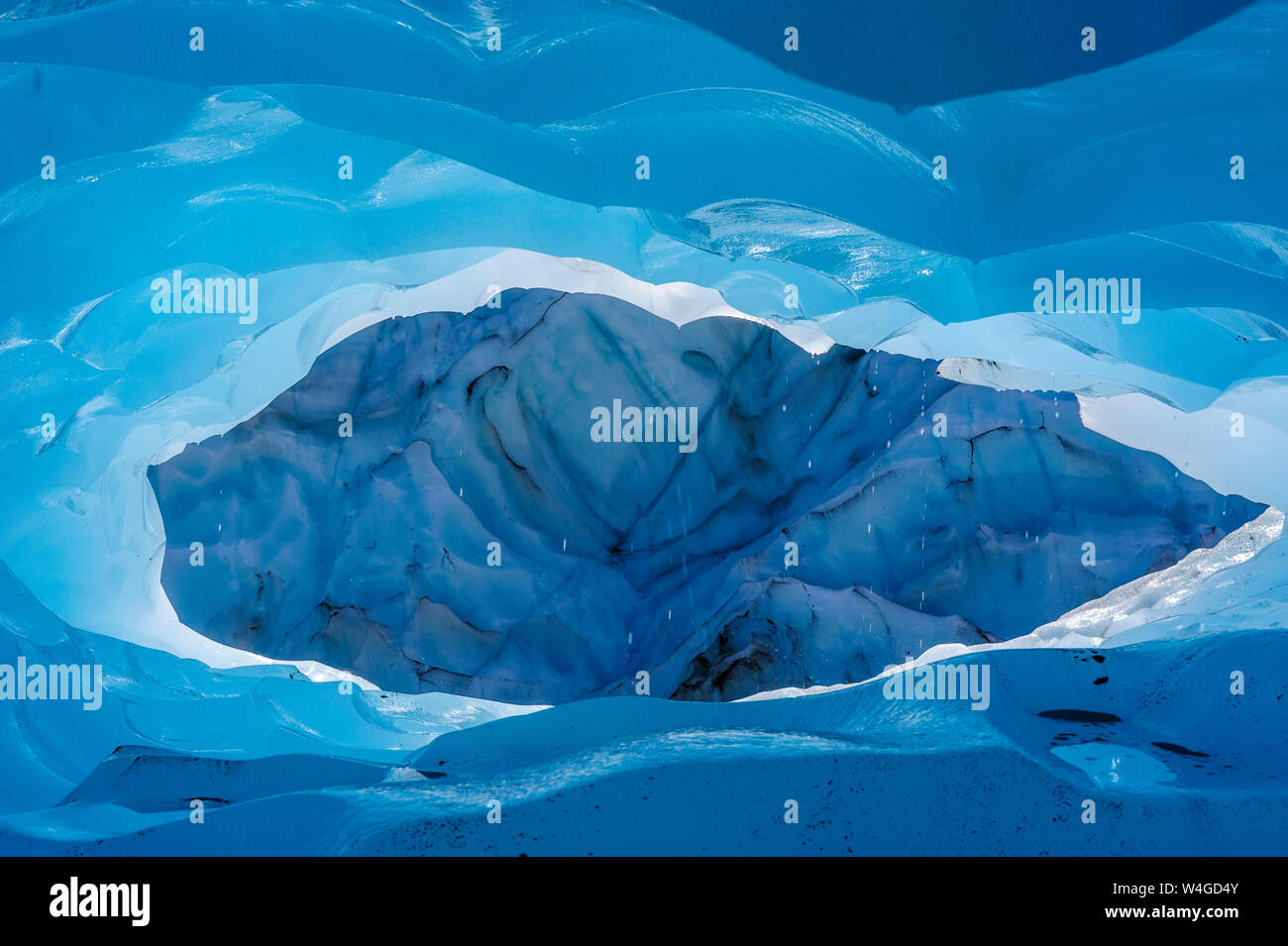 Blue ice in an ice cave in the Fox Glacier, South Island, New Zealand ...