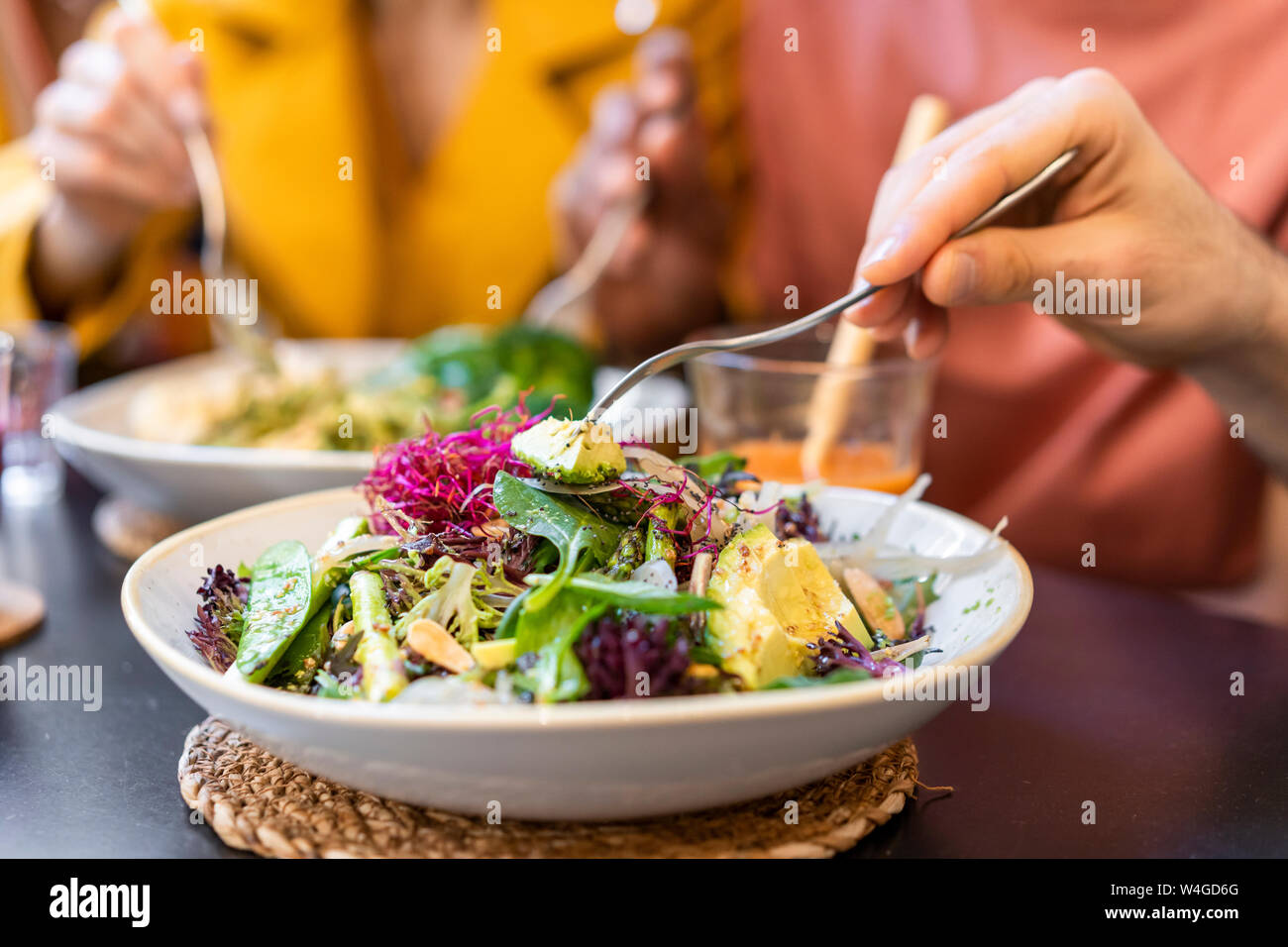 Close-up of people having healthy lunch in a restaurant Stock Photo - Alamy