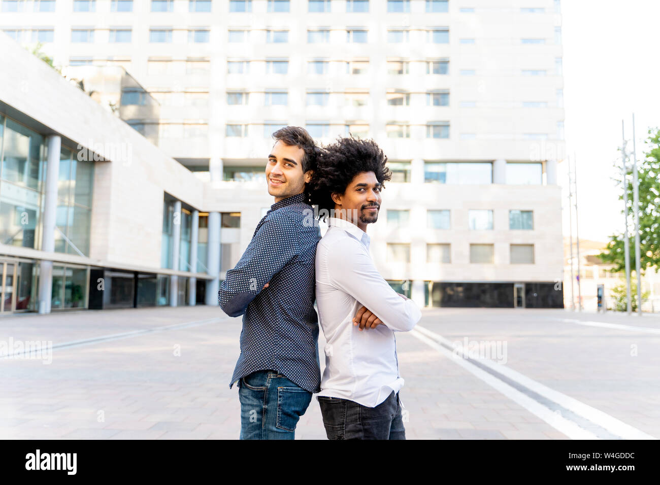 Two business men standing back hi-res stock photography and images - Alamy