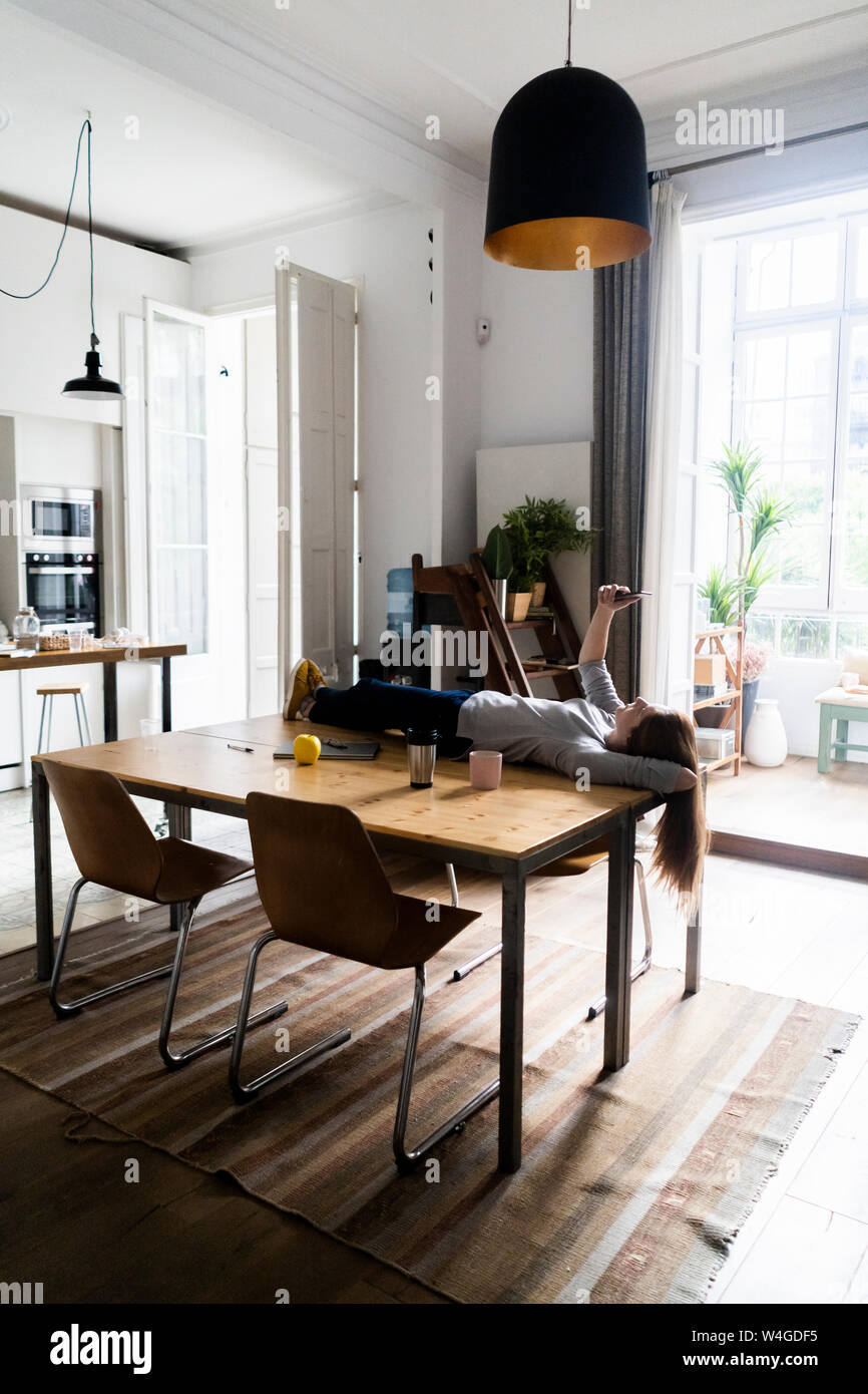 Woman lying on table hi-res stock photography and images - Alamy