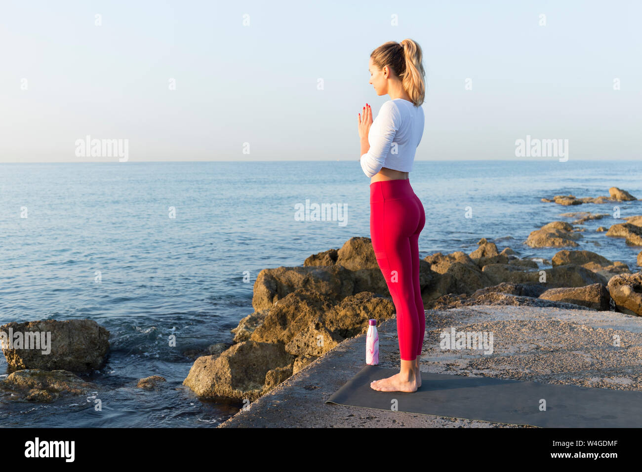 Yoga prayer position hi-res stock photography and images - Alamy
