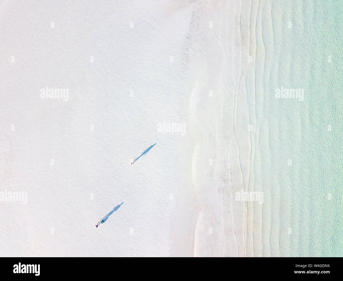 Two people walking together from above hi-res stock photography and ...