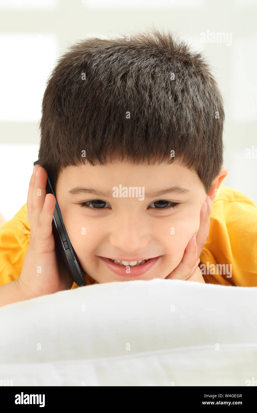 Indian child boy phone talking hi-res stock photography and images - Alamy