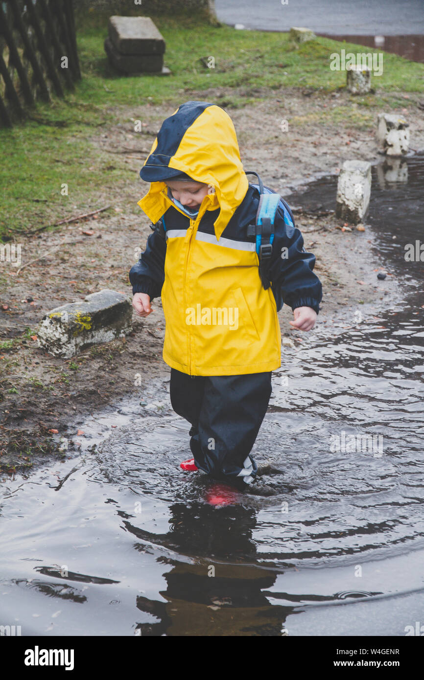 A boy playing in a puddle hi-res stock photography and images - Alamy