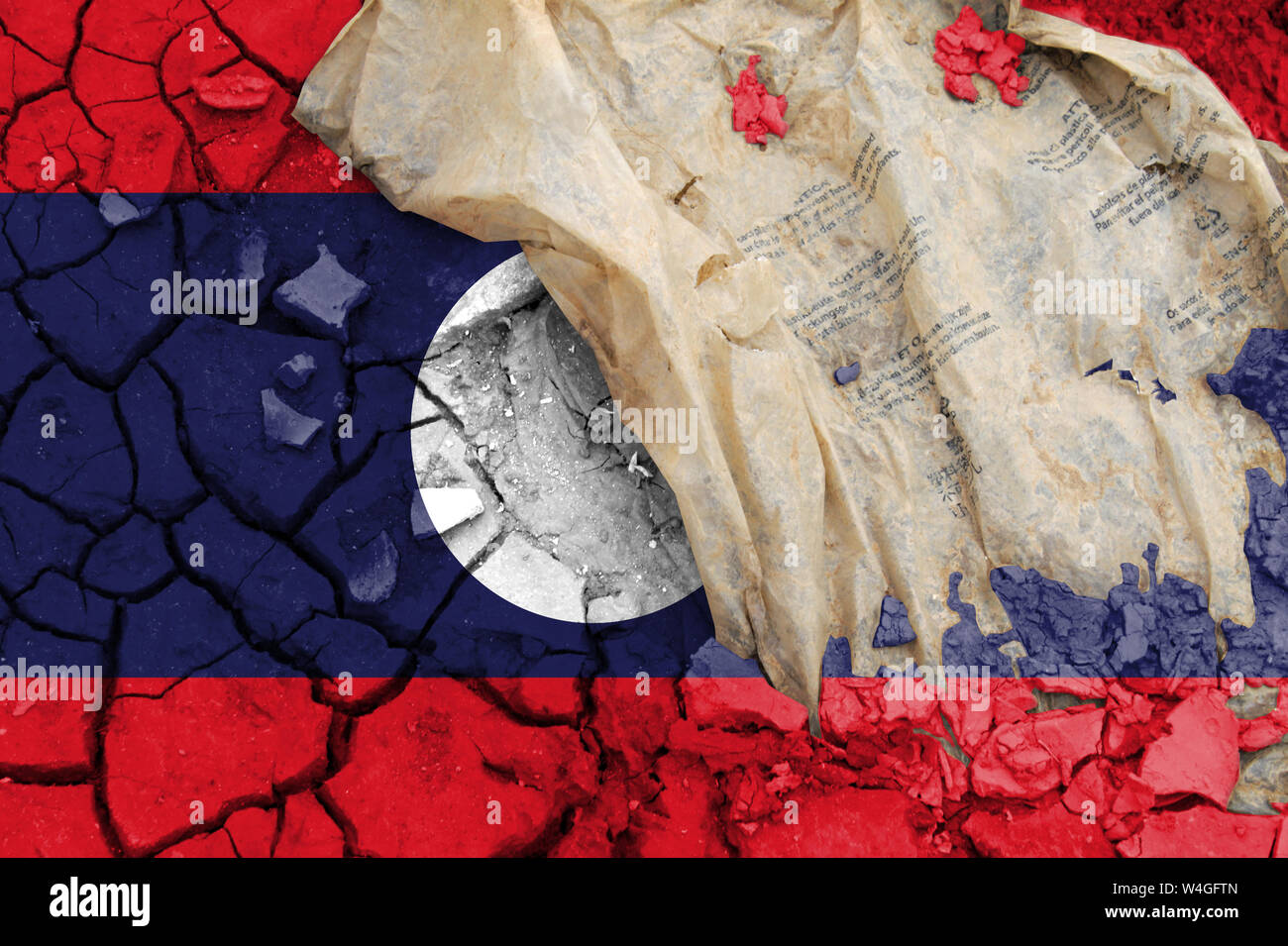 The flag of Laos, the flag is depicted on cracked earth. Ecology ...