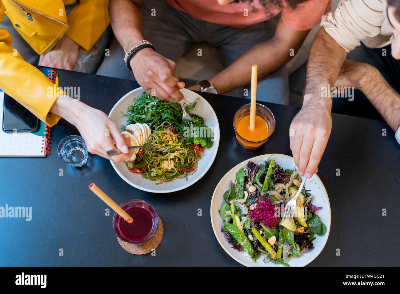 Top view of friends having lunch in a restaurant Stock Photo - Alamy