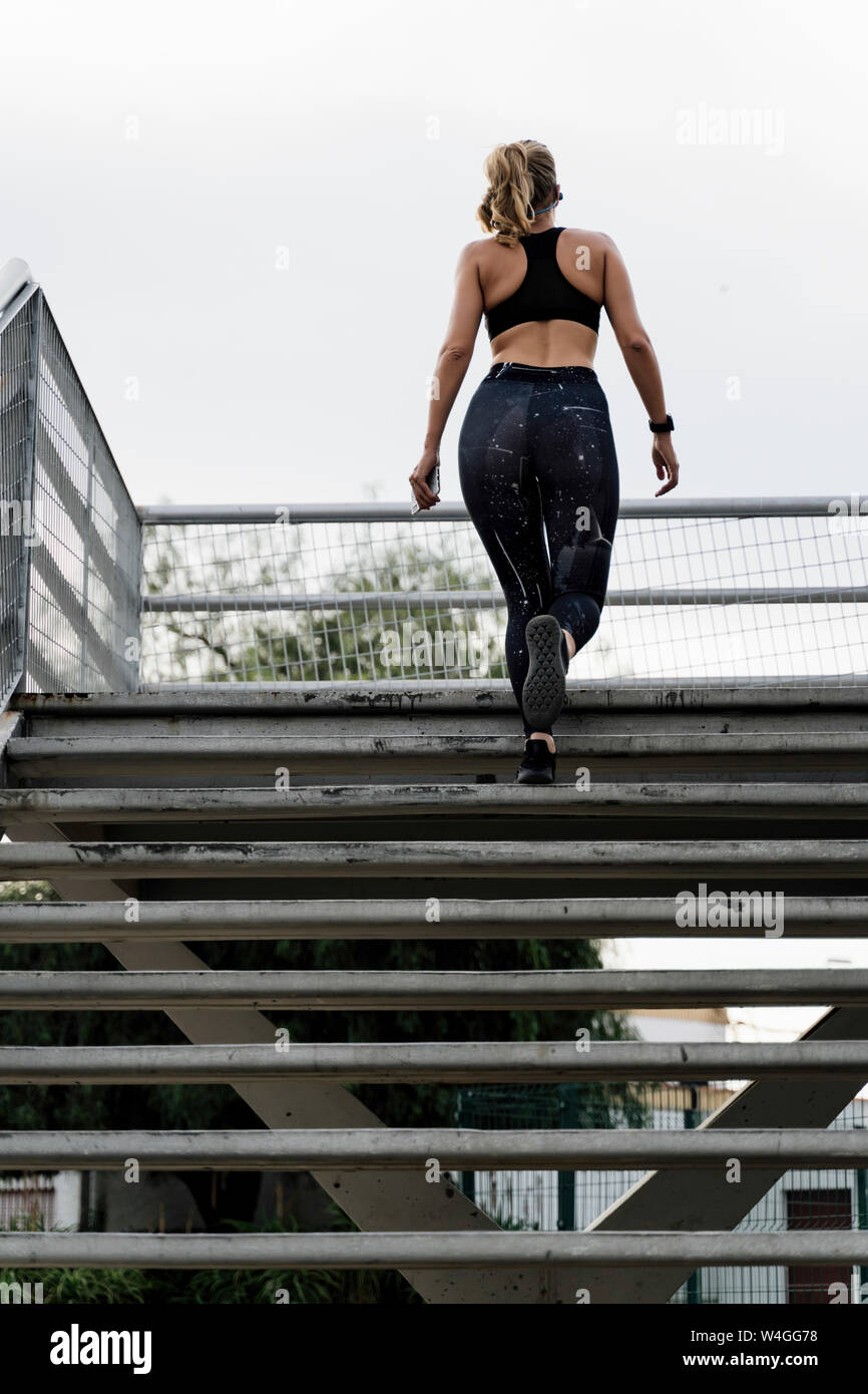 Woman Climbing Stairs
