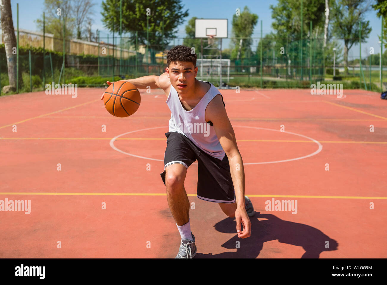 Portrait basketball player dribbling ball hi-res stock photography and ...