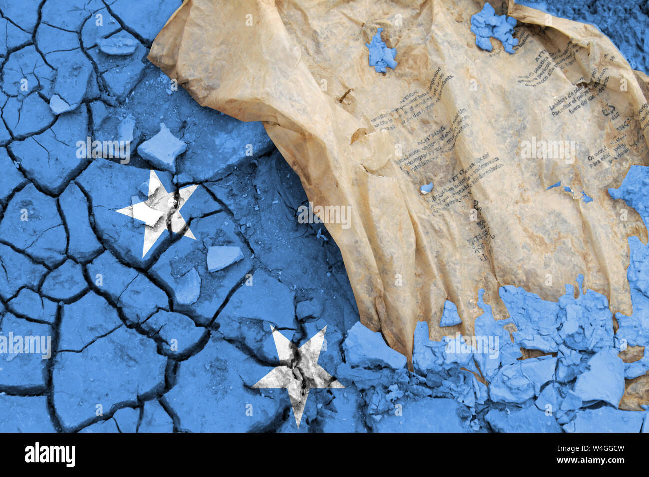 The flag of Micronesia, the flag is depicted on cracked earth. Ecology ...