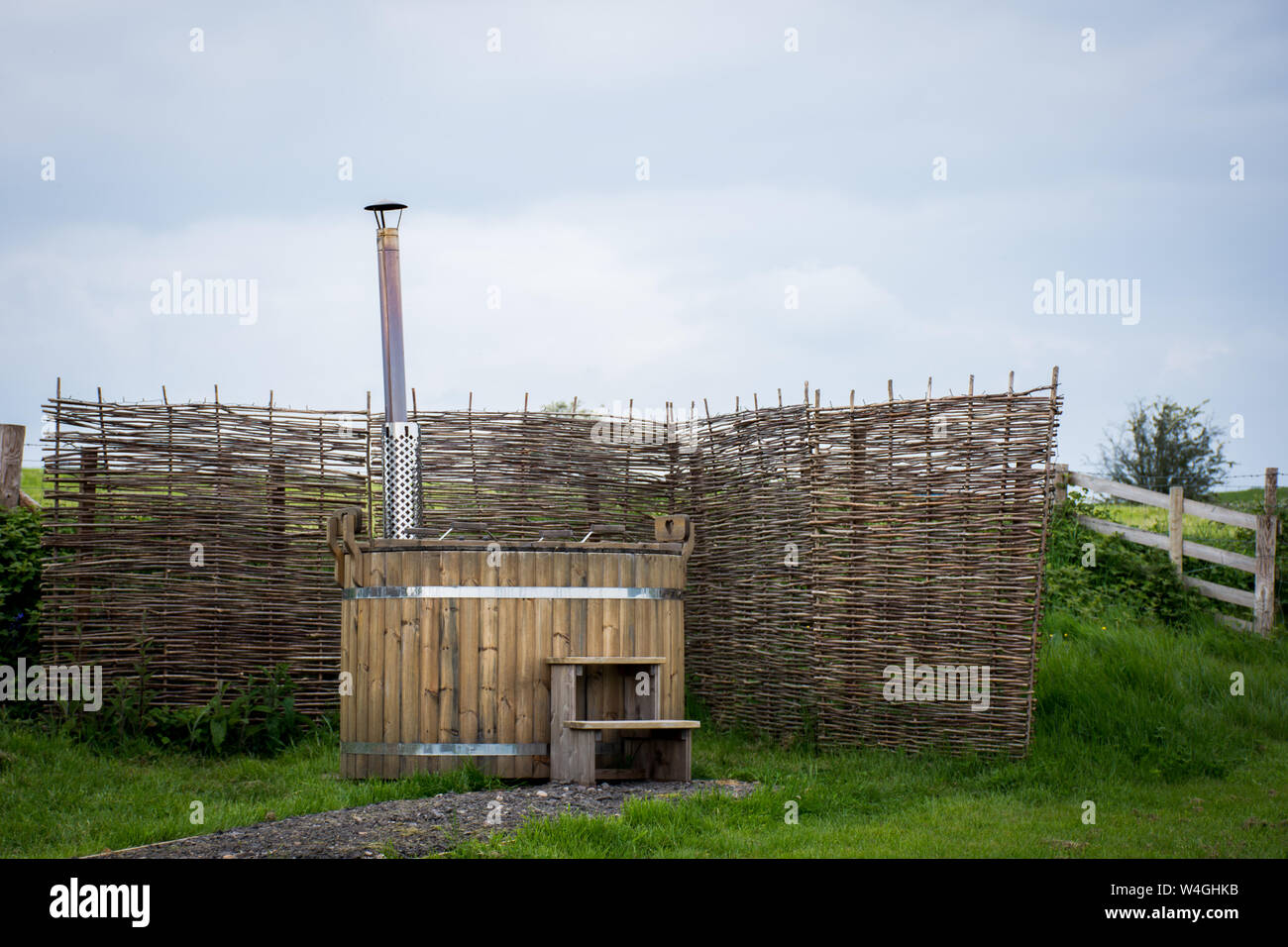 Outdoor traditional wooden wood fired hot tub Stock Photo - Alamy