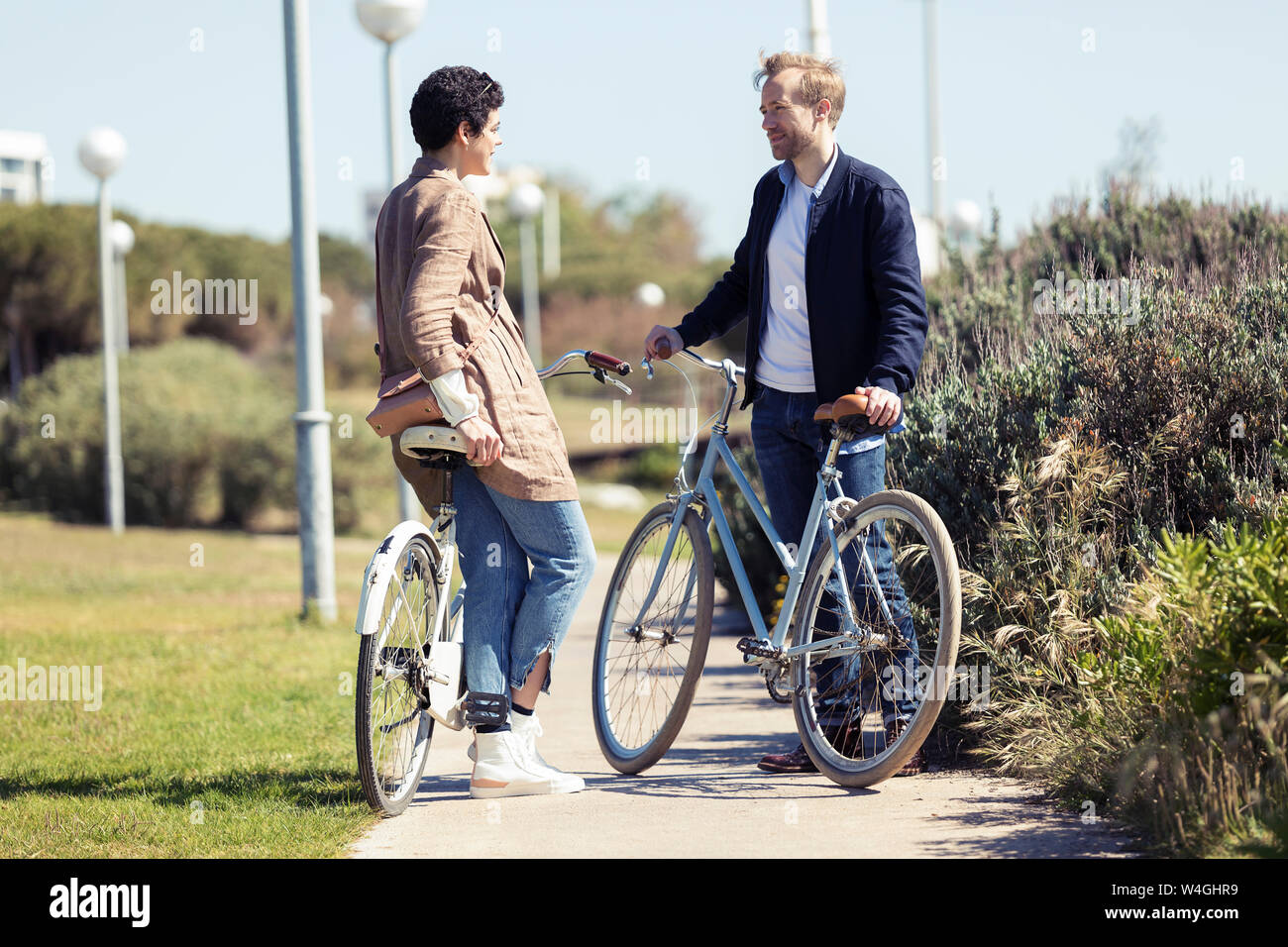 People talking together on bikes hi-res stock photography and images ...
