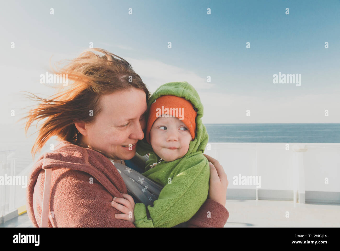 Child carrying a baby hi-res stock photography and images - Alamy