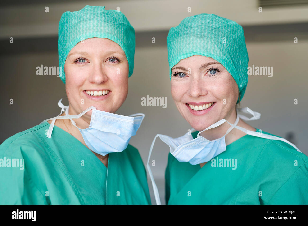 Portrait of two smiling women in scrubs Stock Photo - Alamy