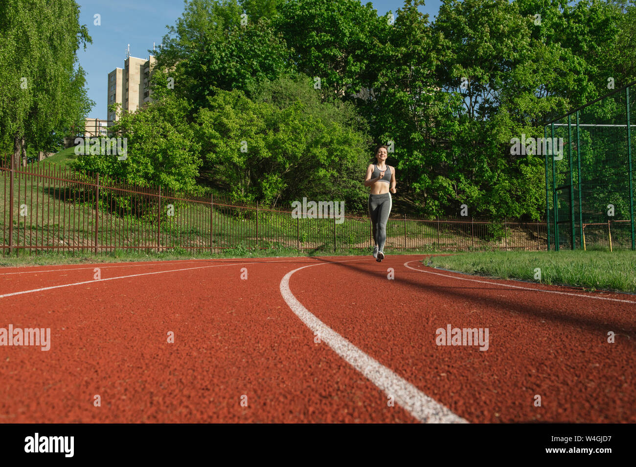 Female athlete running on runing track hi-res stock photography and ...