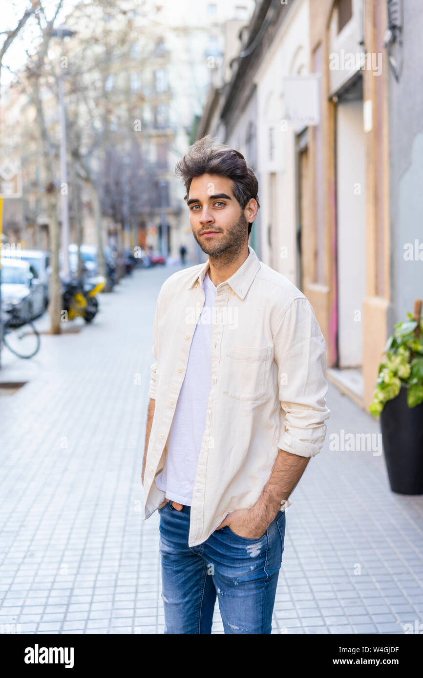 Portrait of a man standing on pavement Stock Photo - Alamy