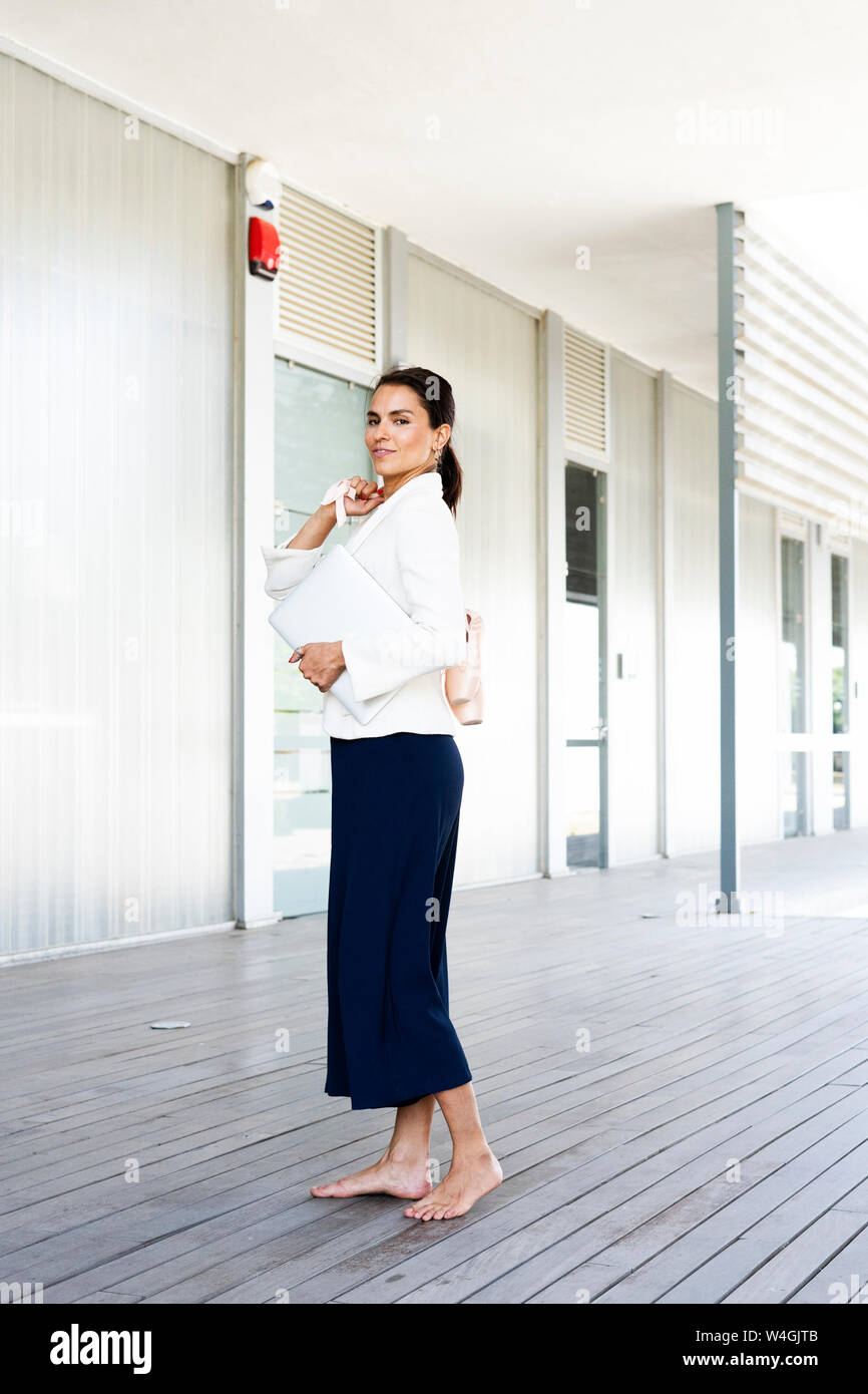 Female ballet dancer in front of an office during work Stock Photo - Alamy