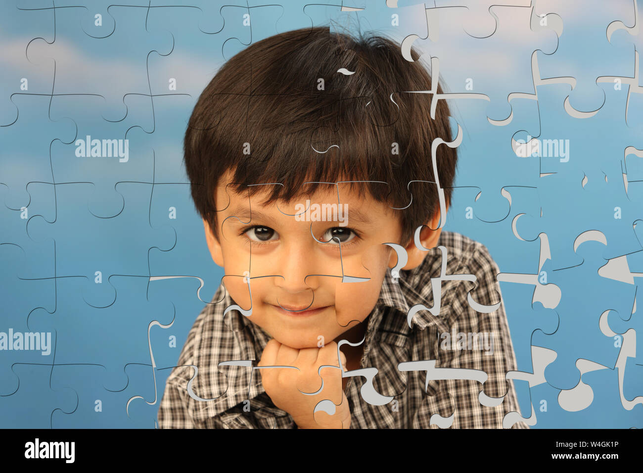 Jigsaw puzzle on a boy Stock Photo - Alamy