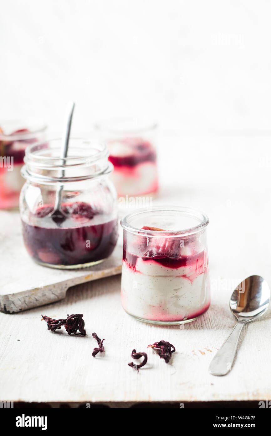 Vegan coconut pudding with rhubarb hibiscus syrup Stock Photo - Alamy