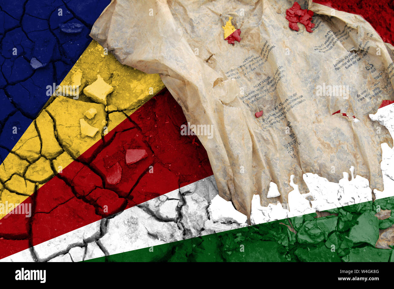 The flag of Seychelles, the flag is depicted on cracked earth. Ecology ...