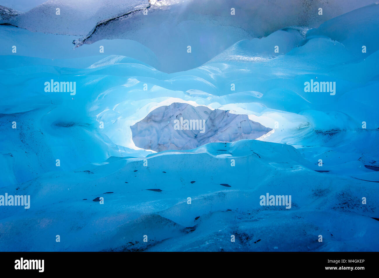 Blue ice in an ice cave in the Fox Glacier, South Island, New Zealand ...