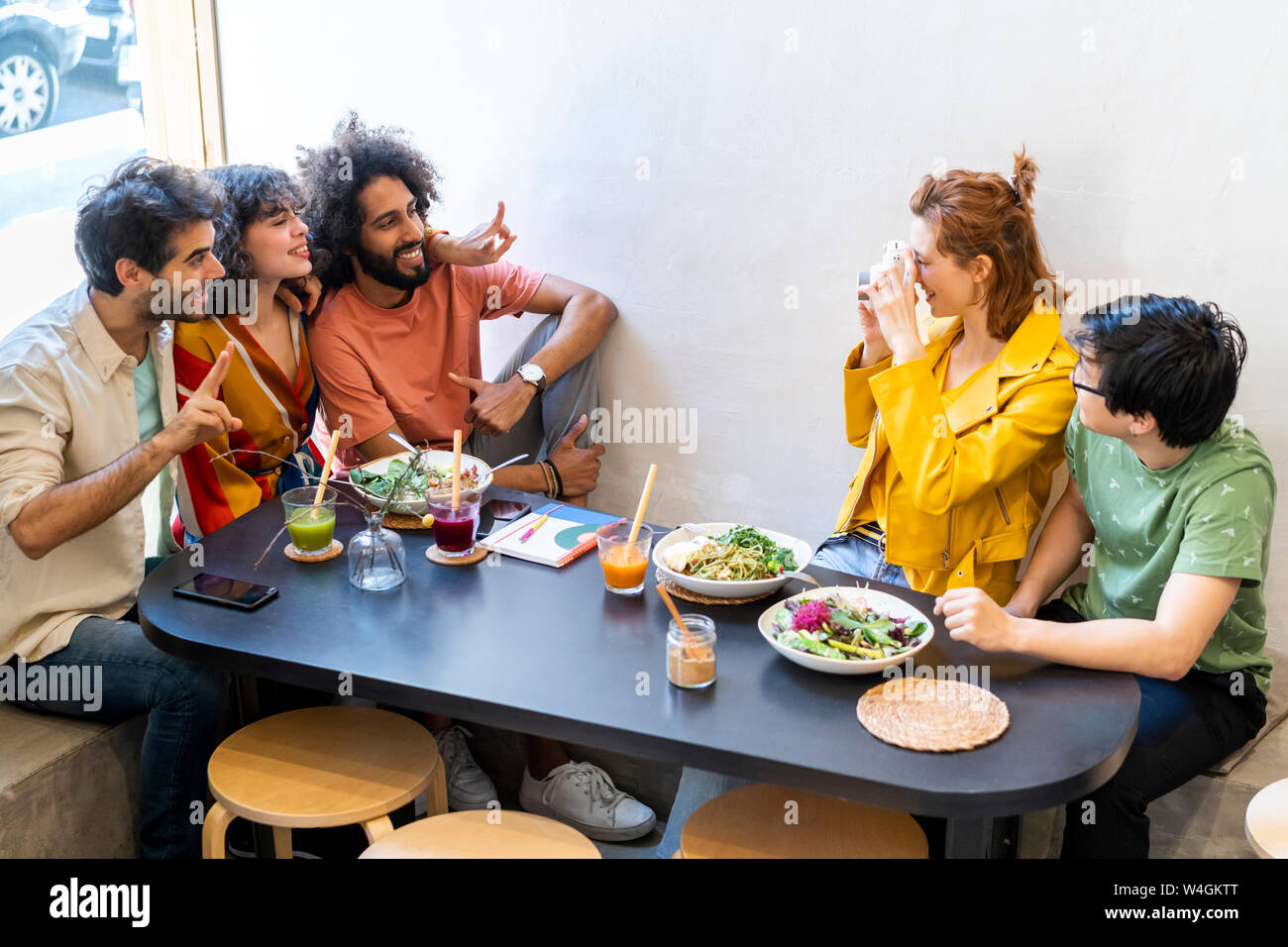 Group of friends having lunch in a restaurant taking a picture Stock ...