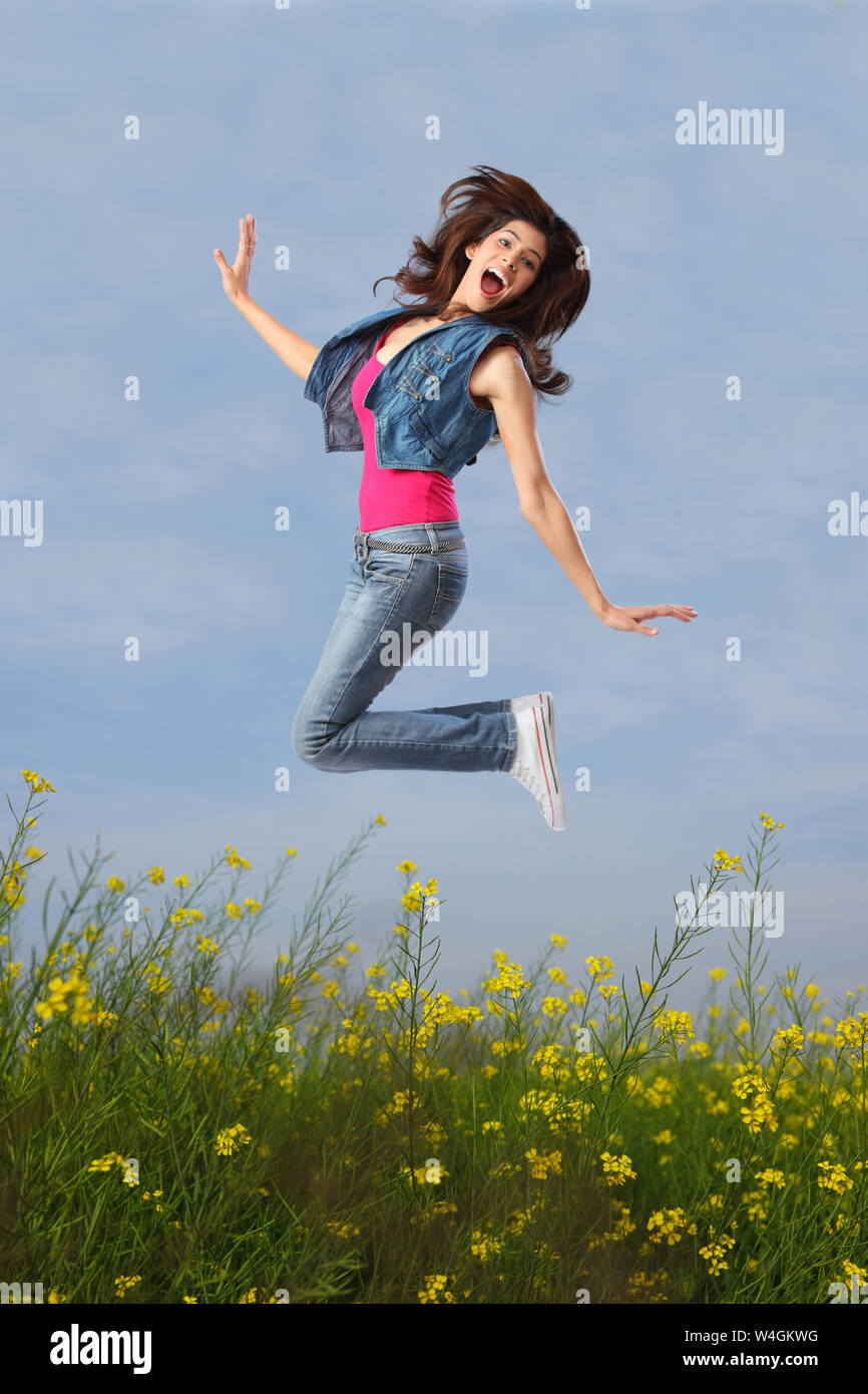 Woman jumping in air Stock Photo - Alamy