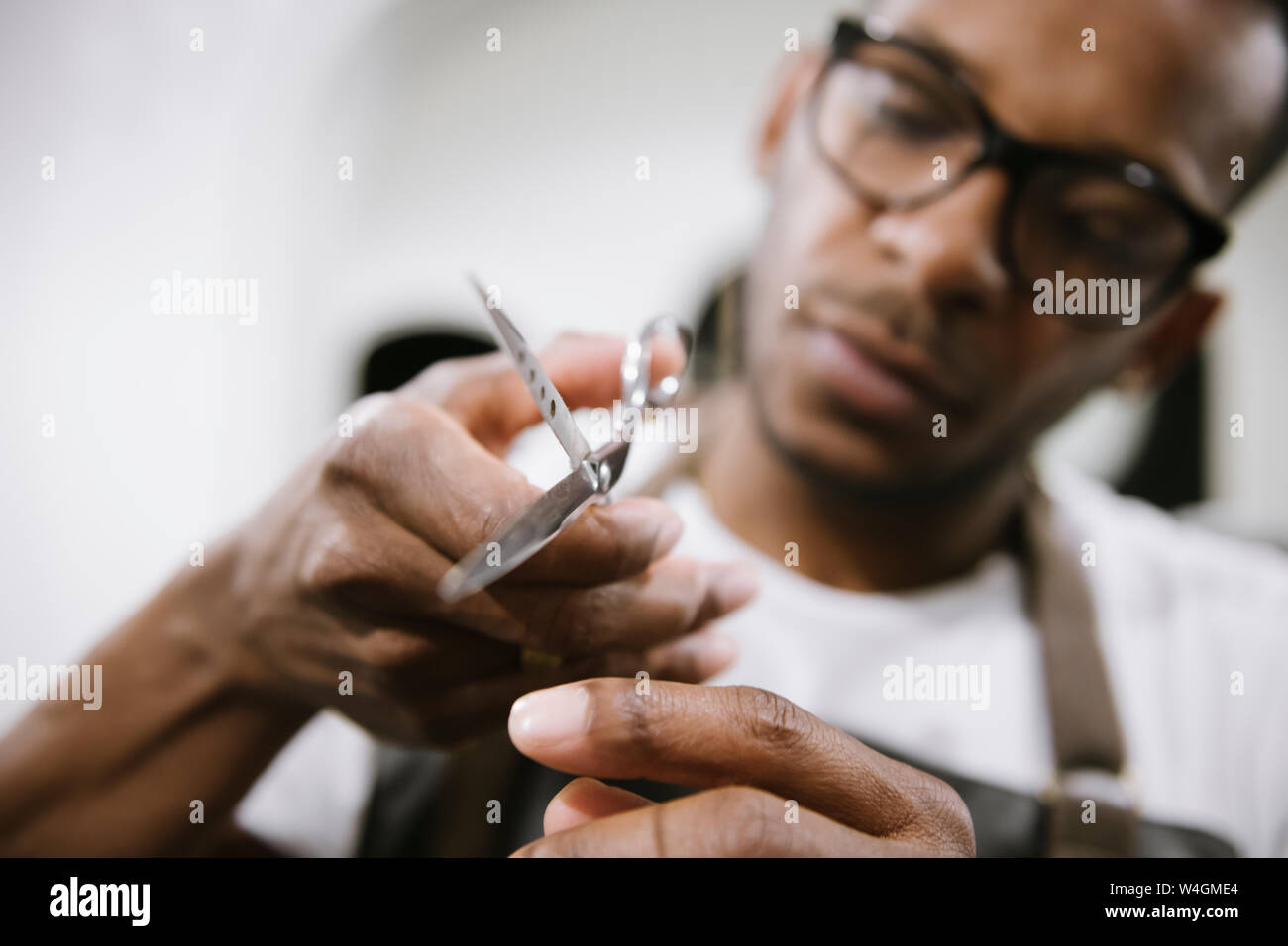 Person holding scissors hi-res stock photography and images - Alamy