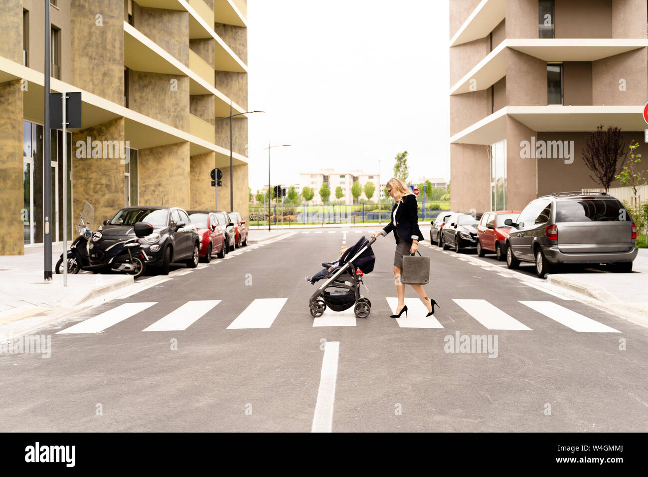 Family with stroller crossing street hi-res stock photography and ...