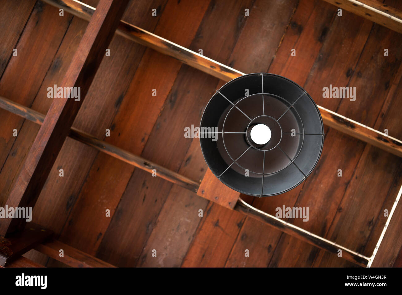 wood ceiling with neon light bulbs in uprisen view.as background ...