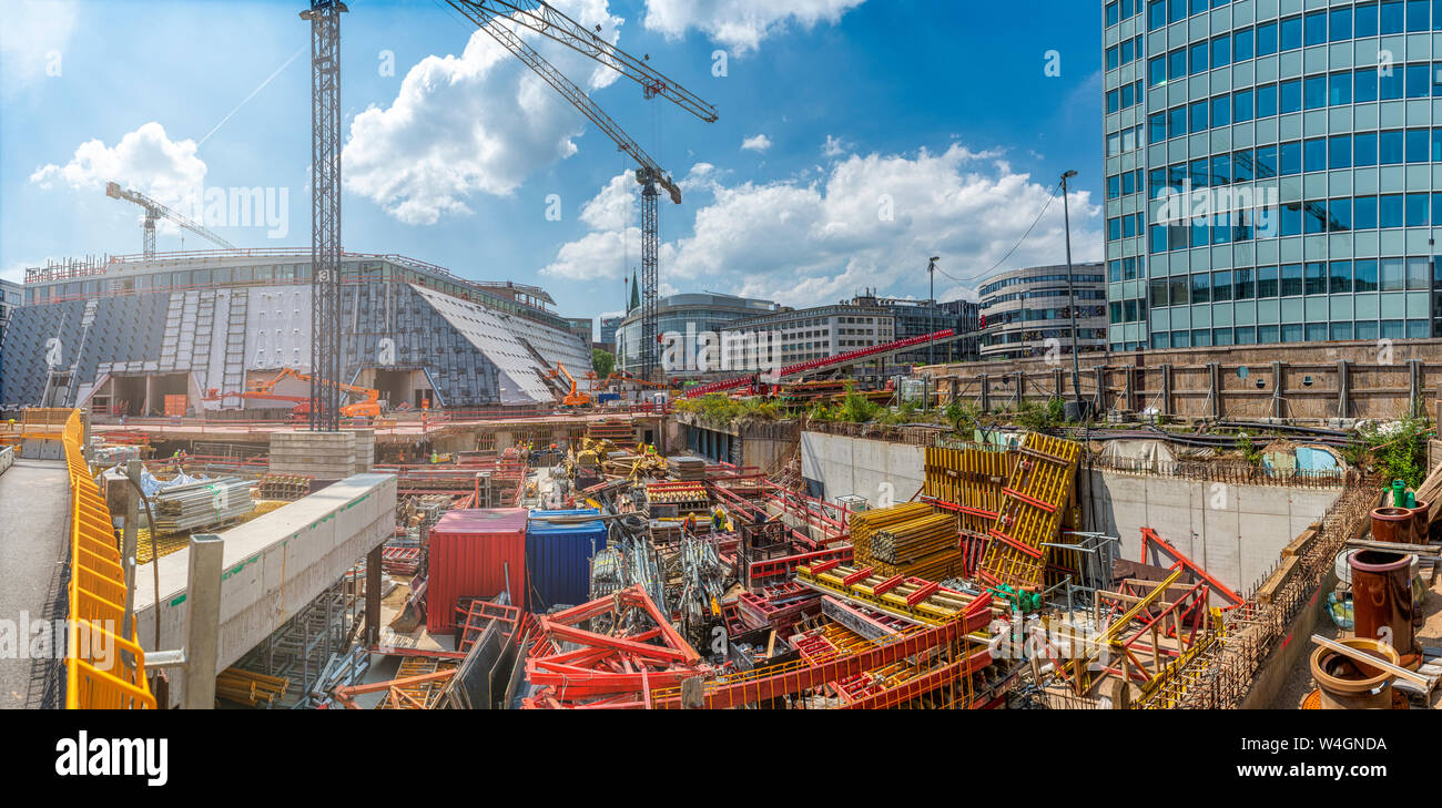 Modern buildings by construction site in city Stock Photo - Alamy