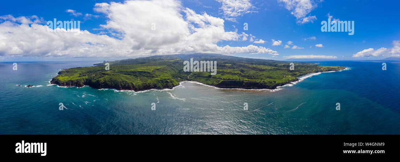 Aerial view over Pacific Ocean and West Maui Mountains, Honokohau Bay ...