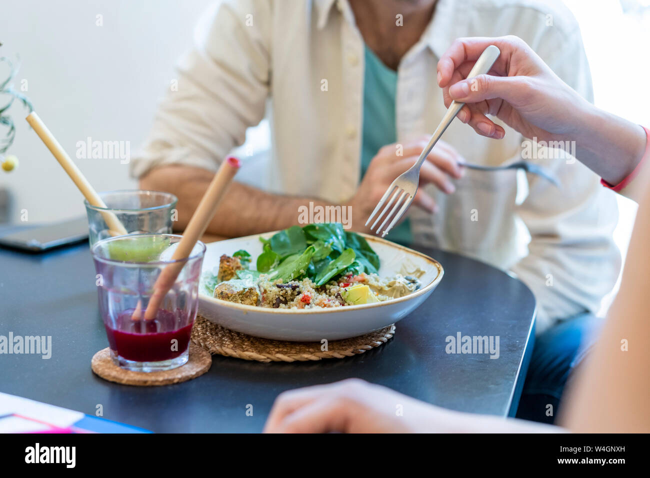 Close-up of people having healthy lunch in a restaurant Stock Photo - Alamy