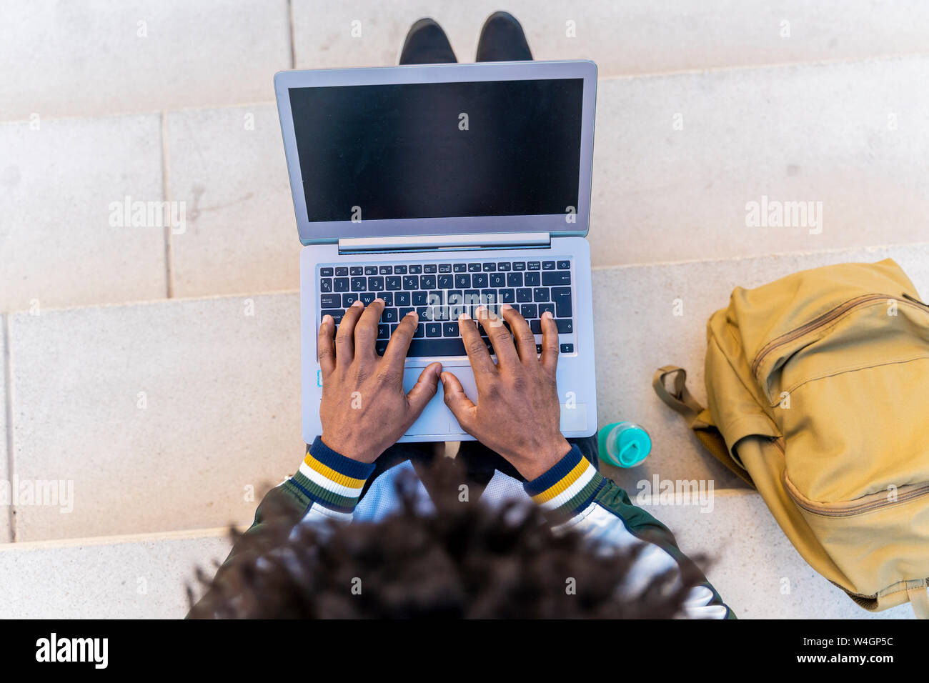 Man sitting at top of stairs hi-res stock photography and images - Alamy