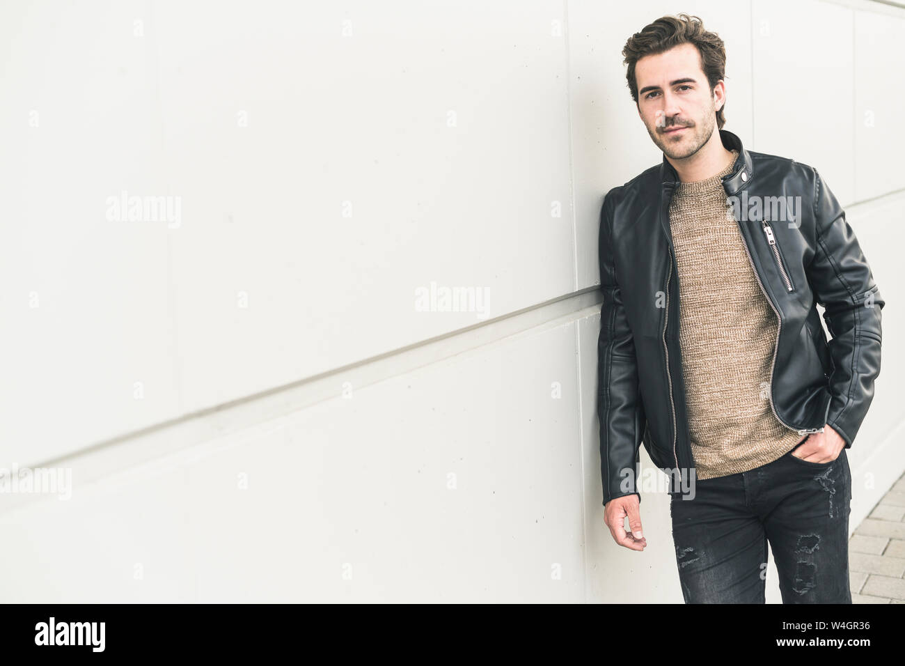 Young man standing in the street hi-res stock photography and images ...