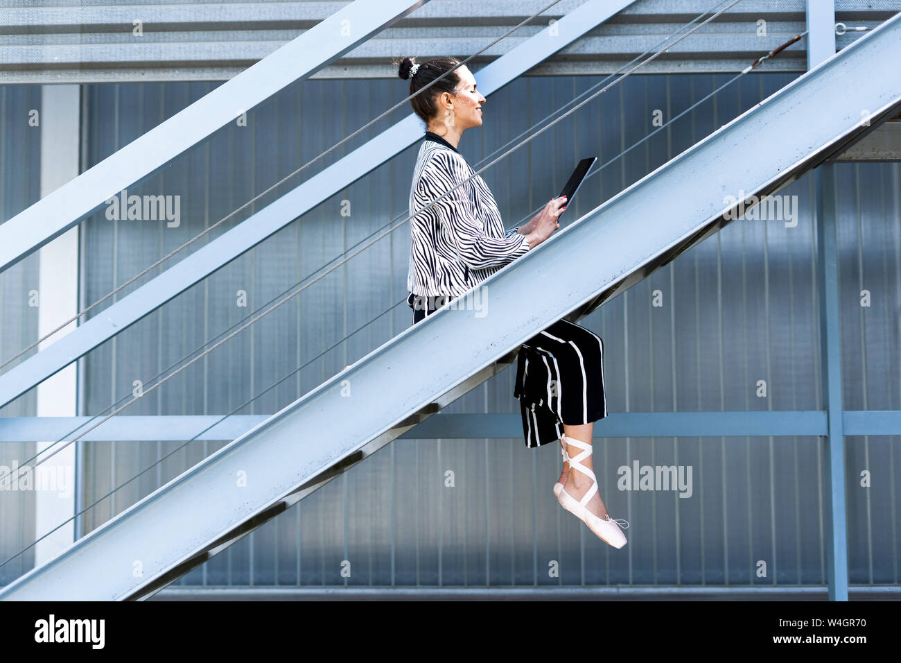 Female ballet dancer using tablet hi-res stock photography and images ...