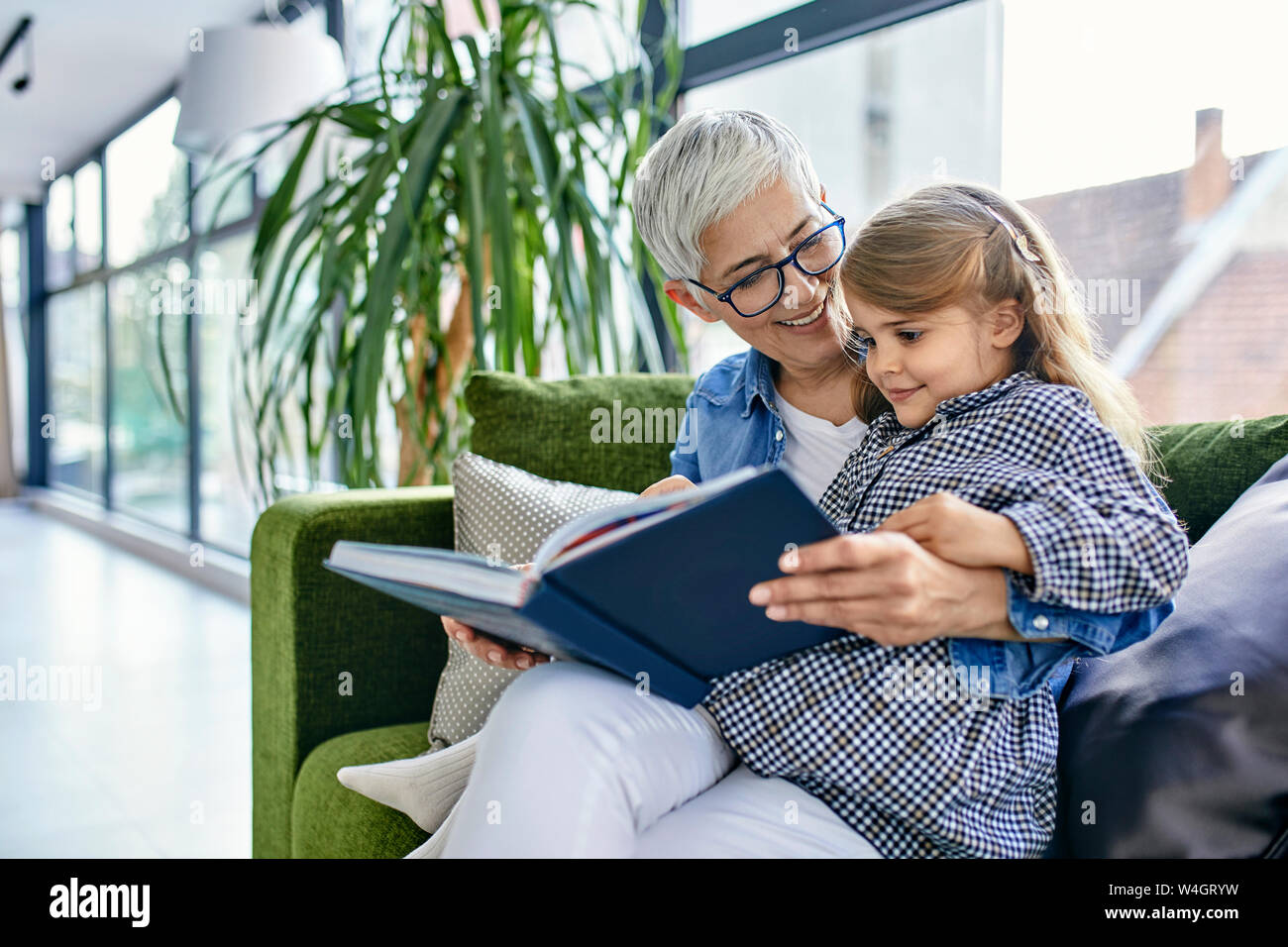 Grandmother child reading book together hi-res stock photography and ...