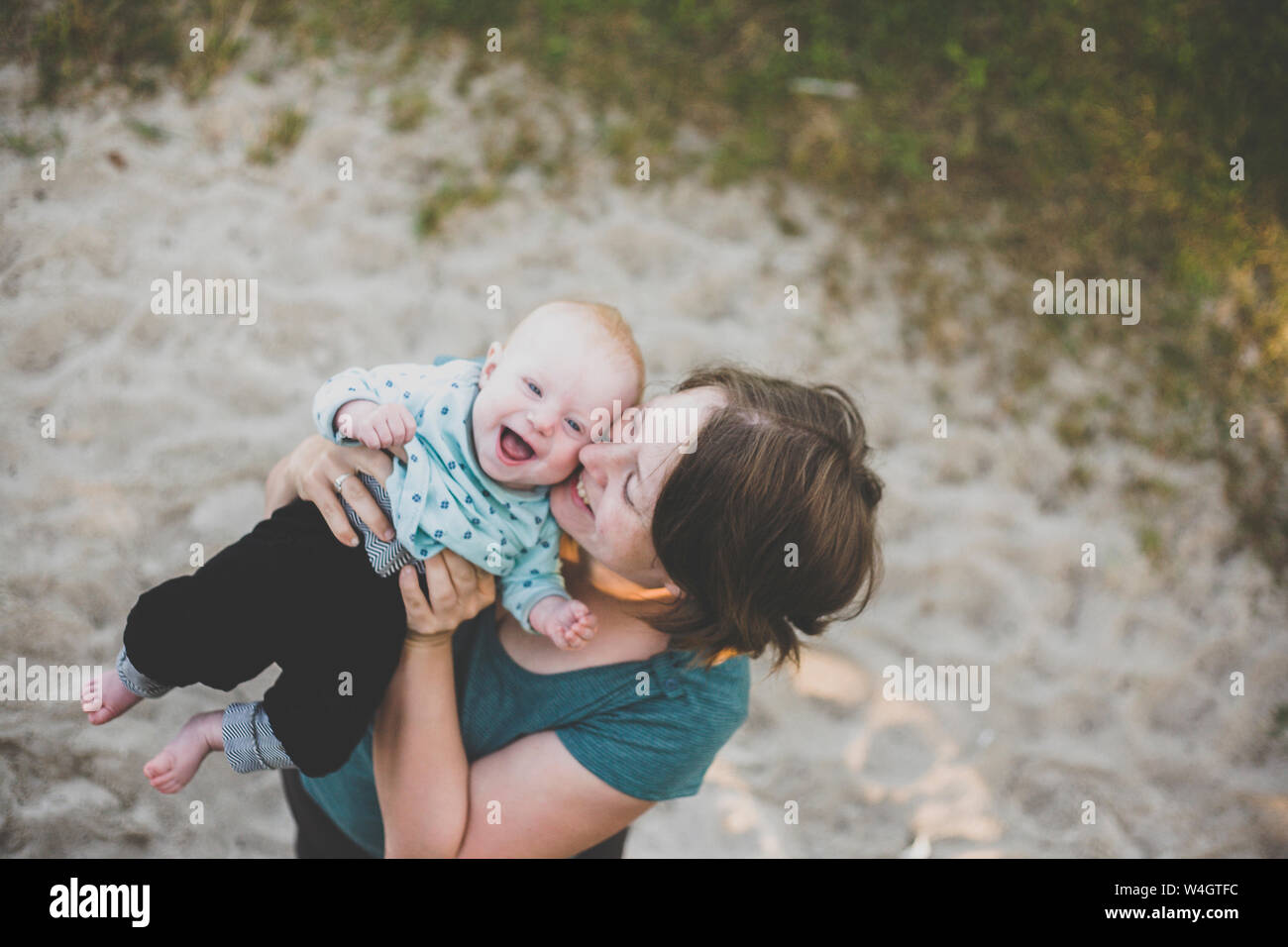 Mother holding her baby girl hi-res stock photography and images - Alamy