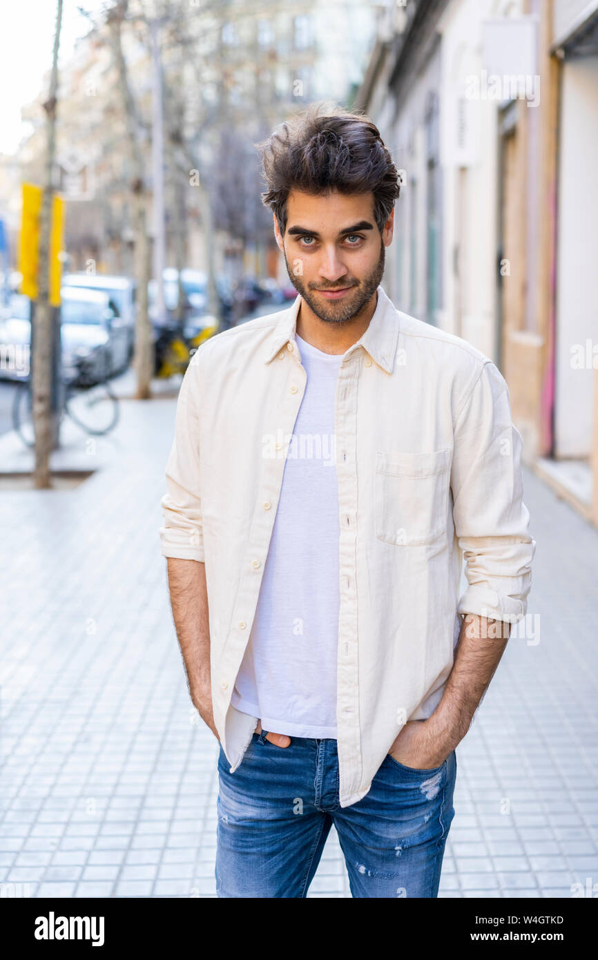 Portrait of a man standing on pavement Stock Photo - Alamy
