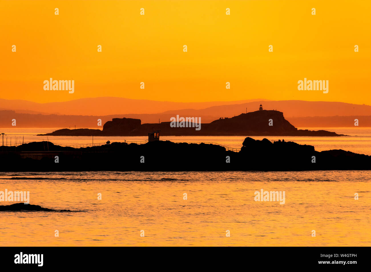 View across North Berwick Harbour towards Fidra Island and Lighthouse ...