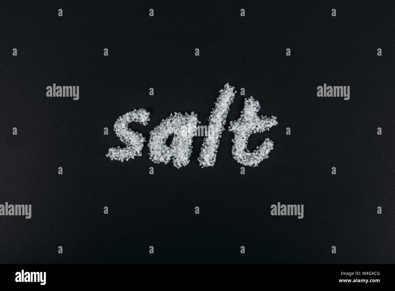top view of word salt made of salt crystals on black background Stock ...