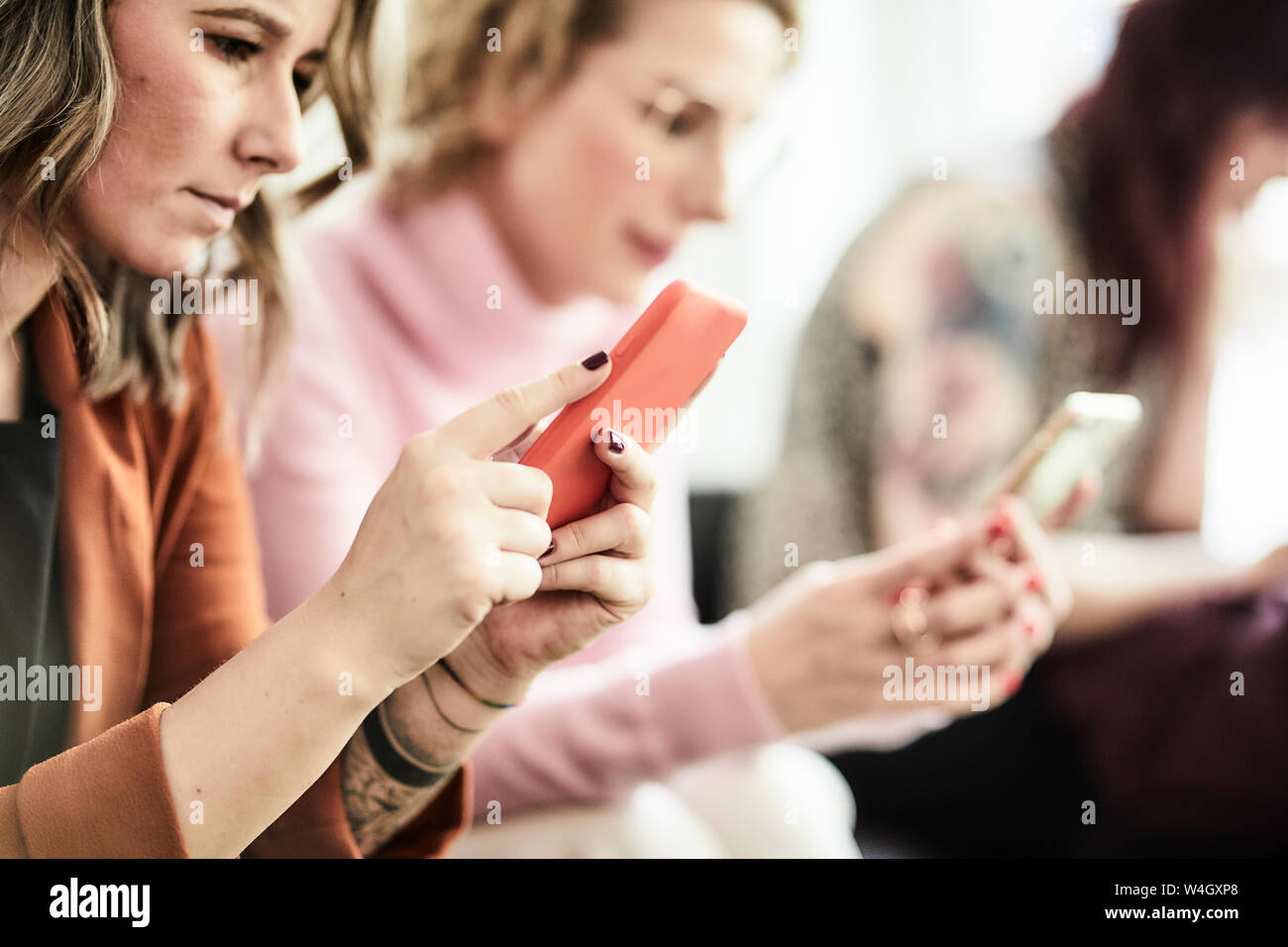 Young people using devices hi-res stock photography and images - Alamy
