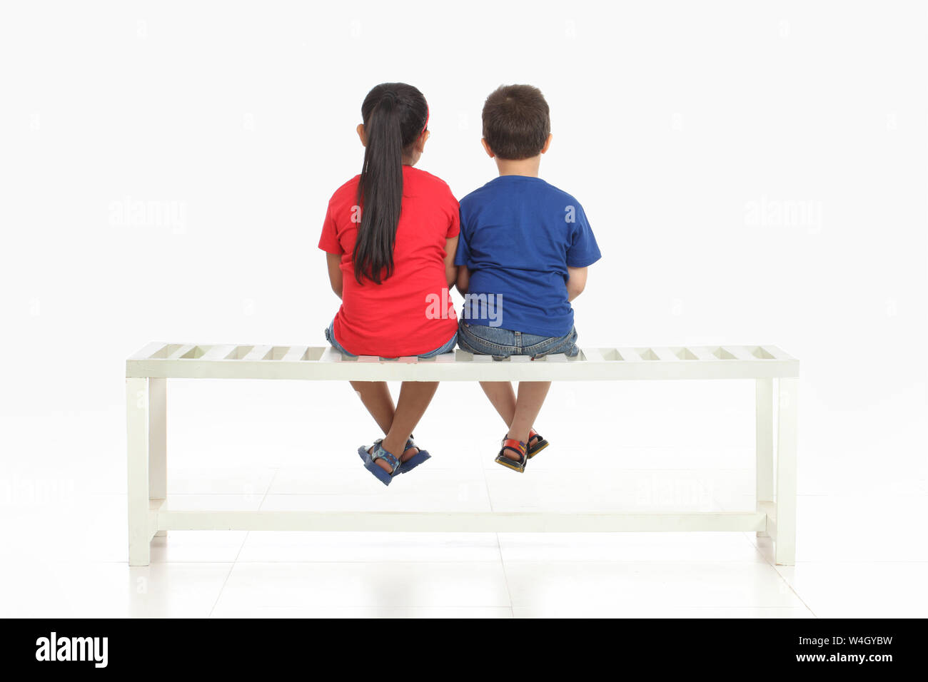 Two girls bonding rear view Cut Out Stock Images & Pictures - Alamy