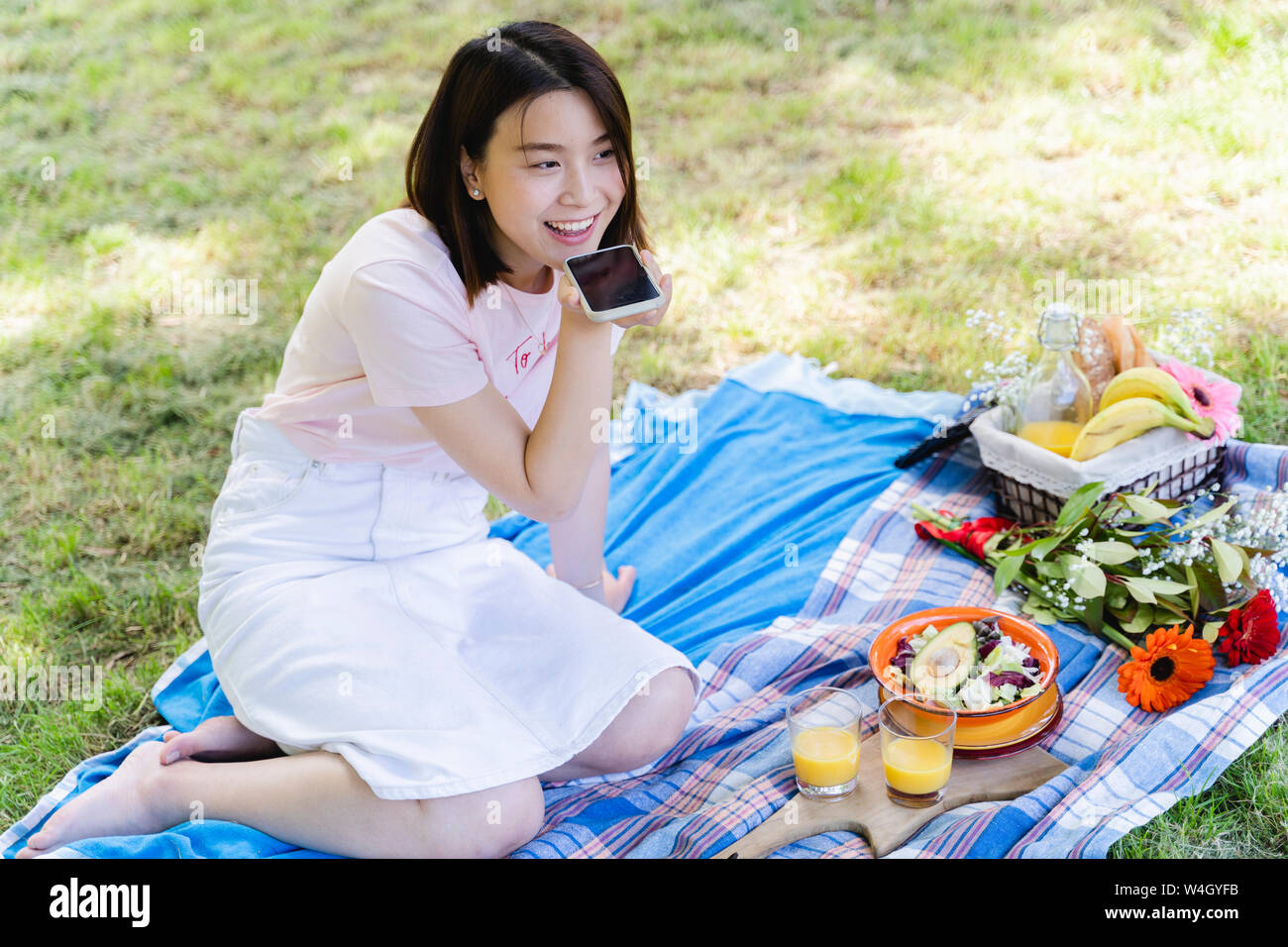 Asian woman enjoying picnic in hi-res stock photography and images - Alamy