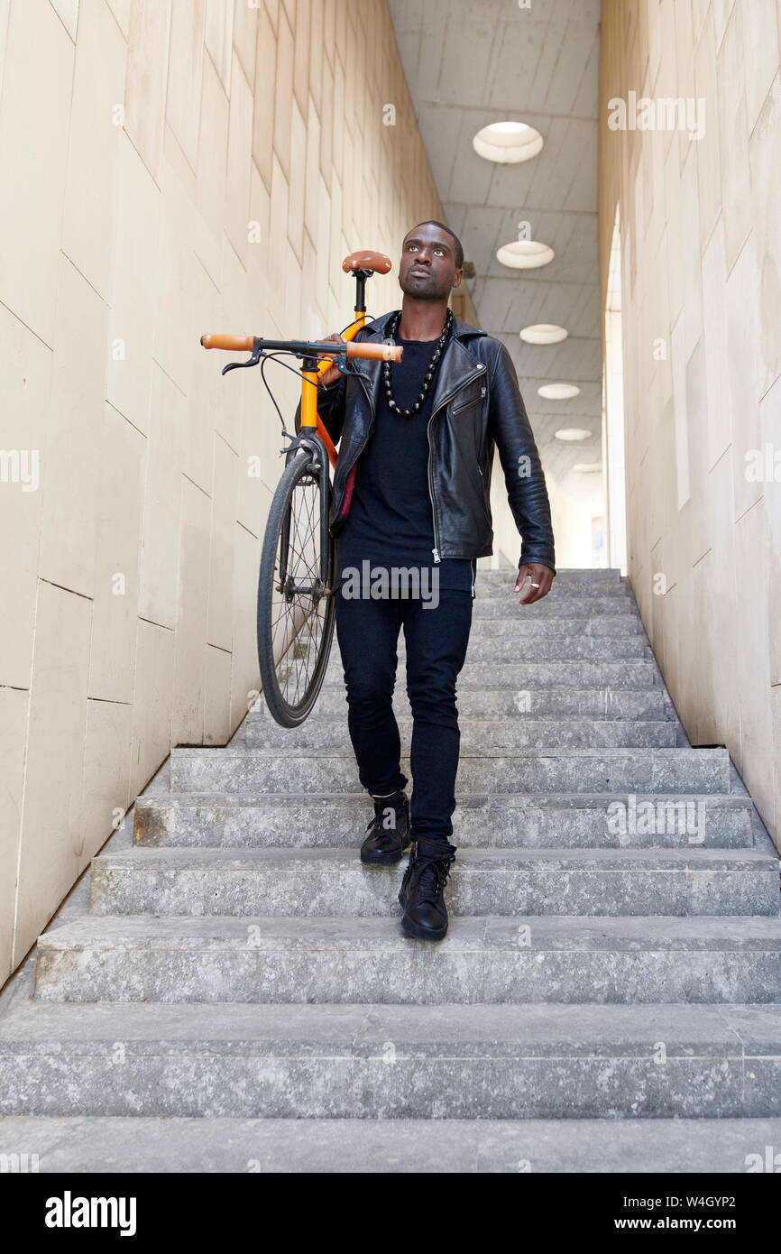 Carrying bicycle cyclist walking hi-res stock photography and images ...